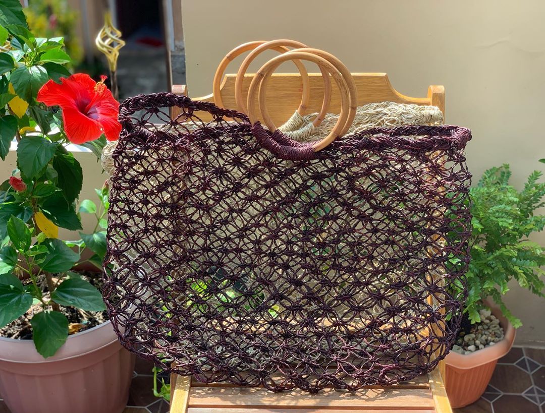 Handwoven pandan bags with rattan handle